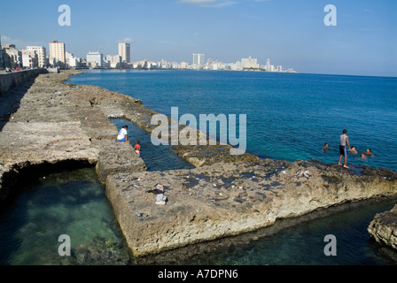Cuban boys swimming at the Malecon Stock Photo: 4354757 - Alamy