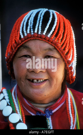 Lisu woman wearing traditional clothing sitting resting with her hand ...