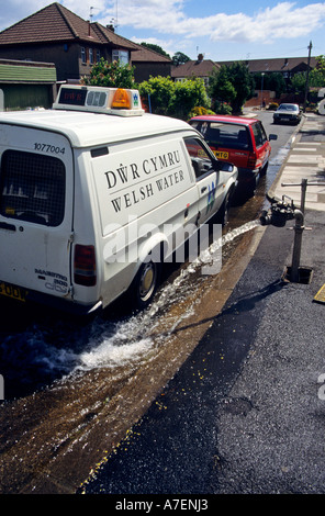 Welsh Water van beside standpipe directing water to waste in street ...