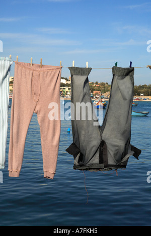 Washing line in Marsaxlokk Malta Stock Photo - Alamy