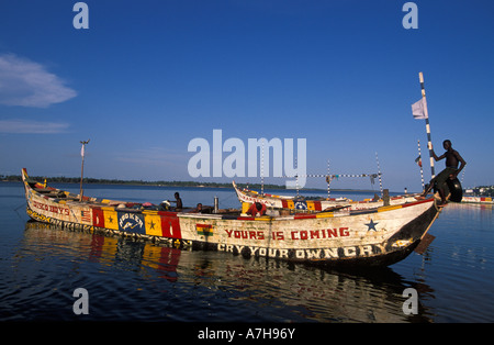 colourful pirogue at the mouth of the Volta river, Volta estuary, Ada ...