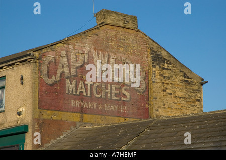 Old and peeling advertisement for Captain Webb matches on the side of a ...