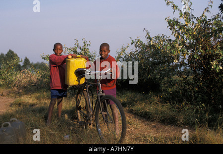 boy fetching water from a river with canister, Haiti, Grande Anse ...