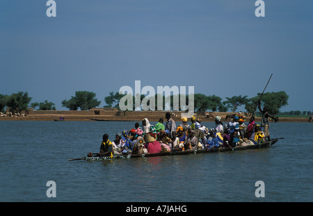 Mali, Niger Inland Delta. A pirogue under sail on the Niger River ...