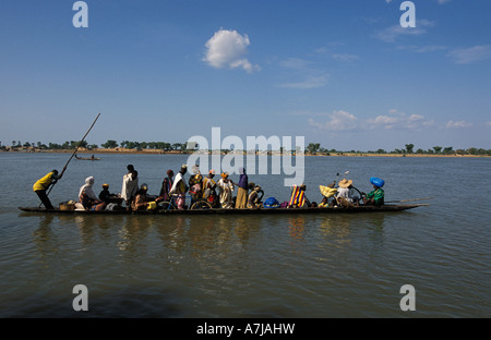 Mali, Niger Inland Delta. A pirogue under sail on the Niger River ...