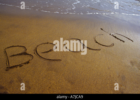 Spain written in the sand at the beach Stock Photo - Alamy
