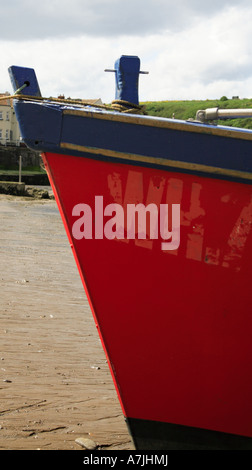 Red anchor and blue hull on an old ship, Irvine harbour, Ayrshire ...