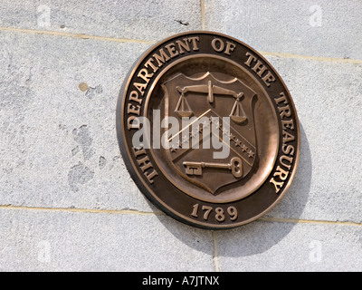 Bronze logo of the US Treasury Department on the wall of the Treasury ...