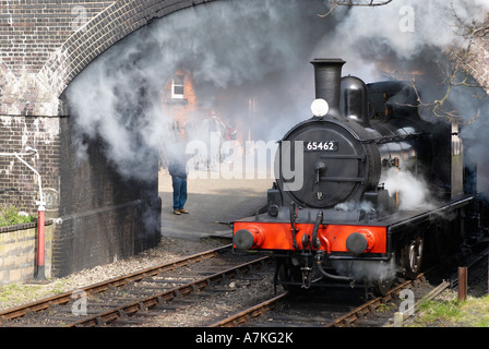 Steam train hauled by J15 class engine leaving Weybourne Station, North ...