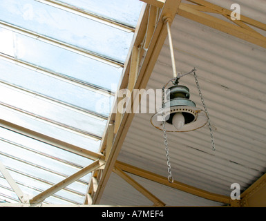 Old light fitting hanging from ceiling Stock Photo - Alamy