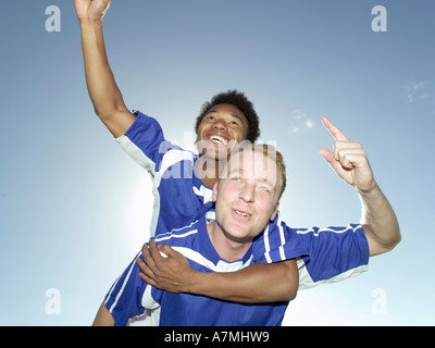 soccer players celebrating victory Stock Photo - Alamy