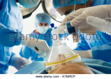 Patient with oxygen mask in an operating room Stock Photo: 72115420 - Alamy