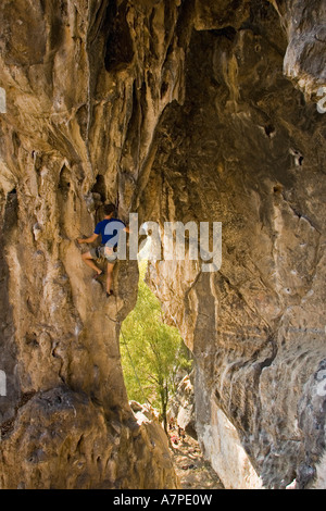 Climbing on limestone stalactites and tufa at Crazy Horse climbing crag ...