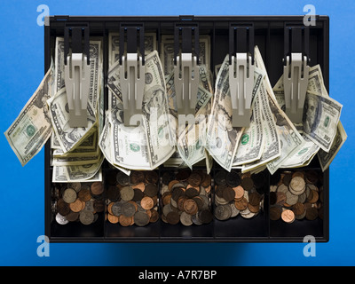 Detailed view of messy US currency and coins in till Stock Photo ...