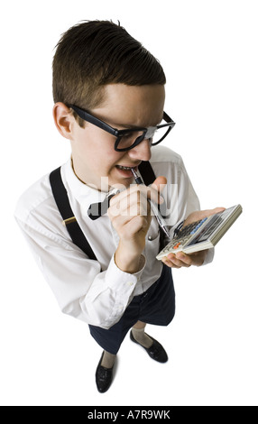 Male nerd with suspenders and tape on eyeglasses smiling with braces ...