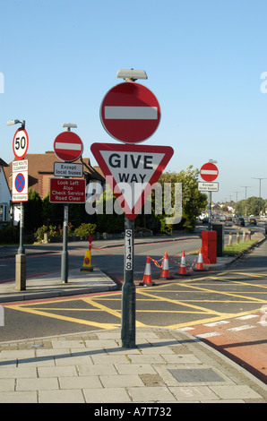 Confusing Road signs at a busy junction in South London England Stock ...
