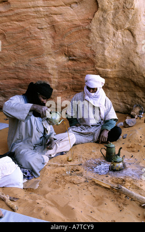 Africa, Algeria, Sahara. Tea ceremony in desert, Touareg dressed in ...