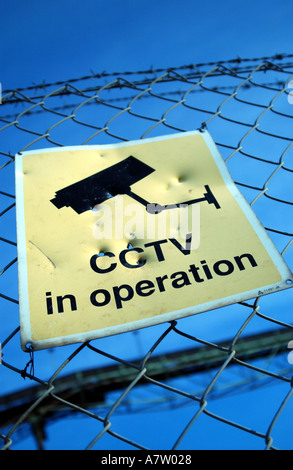 Fencing - yellow sign with blue sky background Stock Photo - Alamy