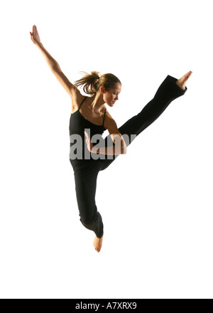 Contemporary dancer floating in mid-air with focused gaze and trench ...