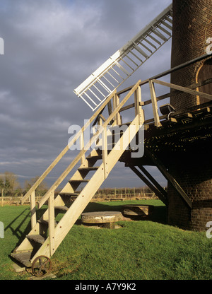 A windmill with wooden steps leading up to it. The windmill is old and ...