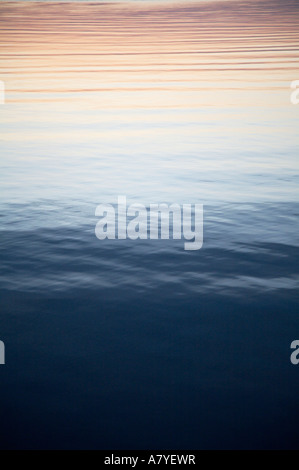 Twilight with reflection of the evening sky in water of the lake ...