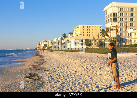 Surfer on a beach in Naples, Florida, USA Stock Photo - Alamy