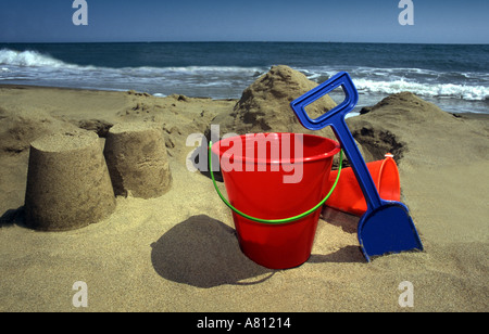 Red Bucket and Spade on Beach Holiday Vacation Concept Stock Photo - Alamy