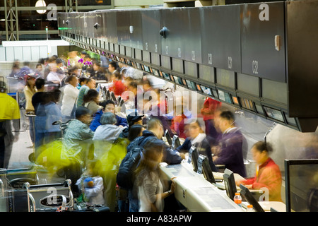 Travelers wait at the ticketing counter in the Tom Bradley terminal at ...