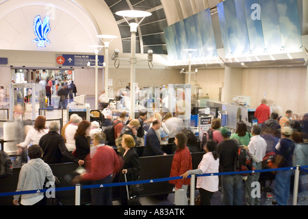 Travelers go through TSA airport security at Seattle-Tacoma ...