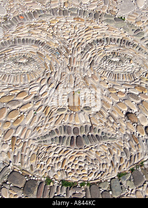 sun figure face made out of stonea and pebbles Stock Photo - Alamy