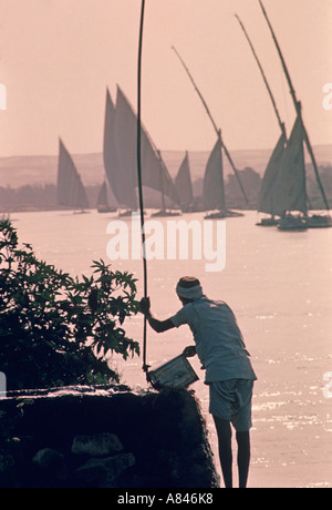Egypt Nile a few kilometers upriver from Cairo. Farmer uses the ancient ...