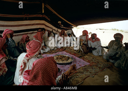 Saudi Arabia, Empty Quarter. Beduin of the al Murrah tribe rest in ...