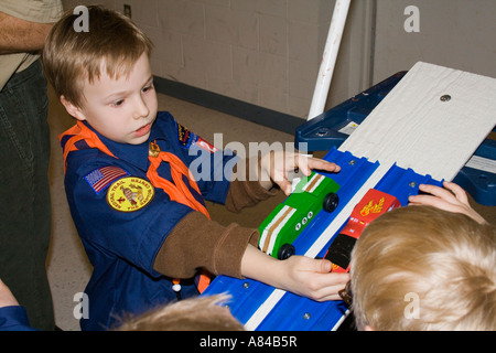 Cub Scout age 7 starting race cars in the Pinewood Derby. Horace Mann ...