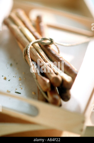 Home made bread on a wooden cutting board with curd cheese and ricotta ...