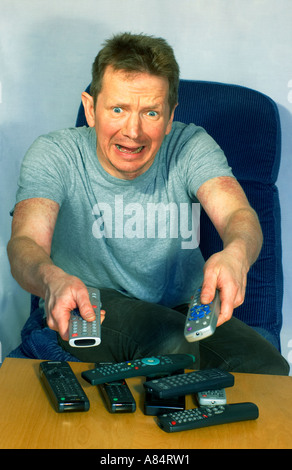 Remote control confusion Stock Photo - Alamy