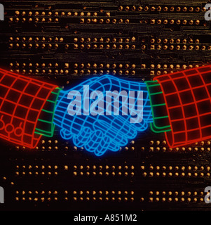 Business concept: circuit board with Handshake Stock Photo - Alamy