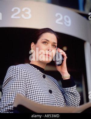 Close-up portrait of executive business people standing in a row at ...