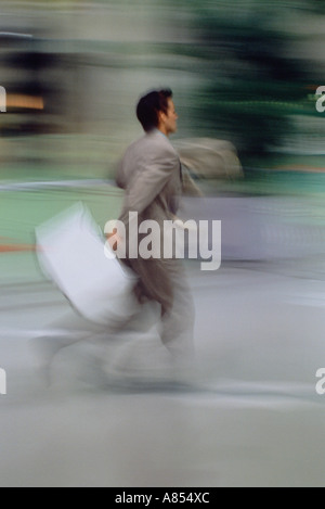 Man running to catch plane Stock Photo - Alamy
