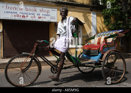 Lifestyle of India with Manual Rickshaw wala on the wet streets of ...