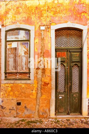Old door of a poor house Stock Photo - Alamy