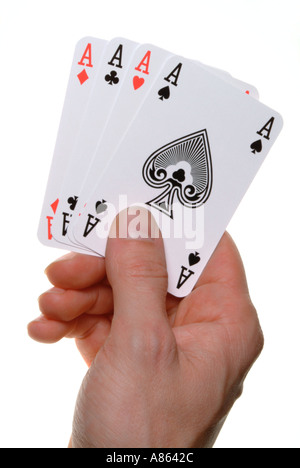 man's hand with four cards Stock Photo - Alamy