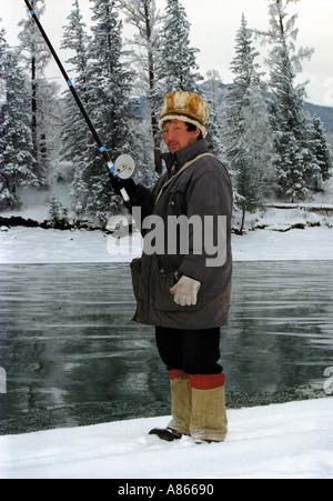 Altai native man is fishing Stock Photo - Alamy