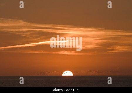 The sun sets over the Atlantic Ocean at St Agnes, North Cornwall Stock ...