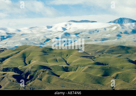 Snow topped mountains and green hills around Berat, Albania Stock Photo ...