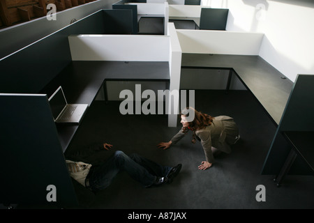 Office workers crawling under their desks Stock Photo - Alamy