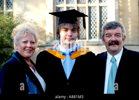 freshly graduated student with proud parents Stock Photo - Alamy