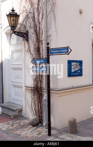 A blue information sign on a metal wire fence with a white graphic icon ...