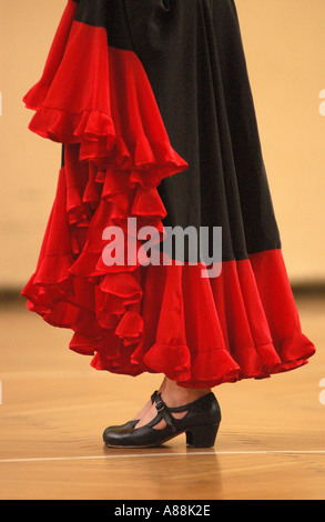 Spanish female in black wearing a face mask outdoors - concept of the ...