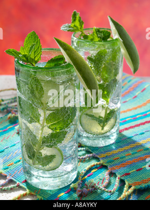 two glasses with fresh cold mojito cocktail on table Stock Photo - Alamy