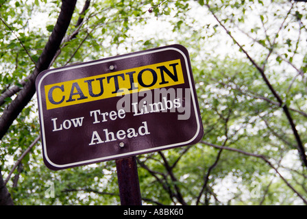Low tree limbs caution sign Stock Photo - Alamy